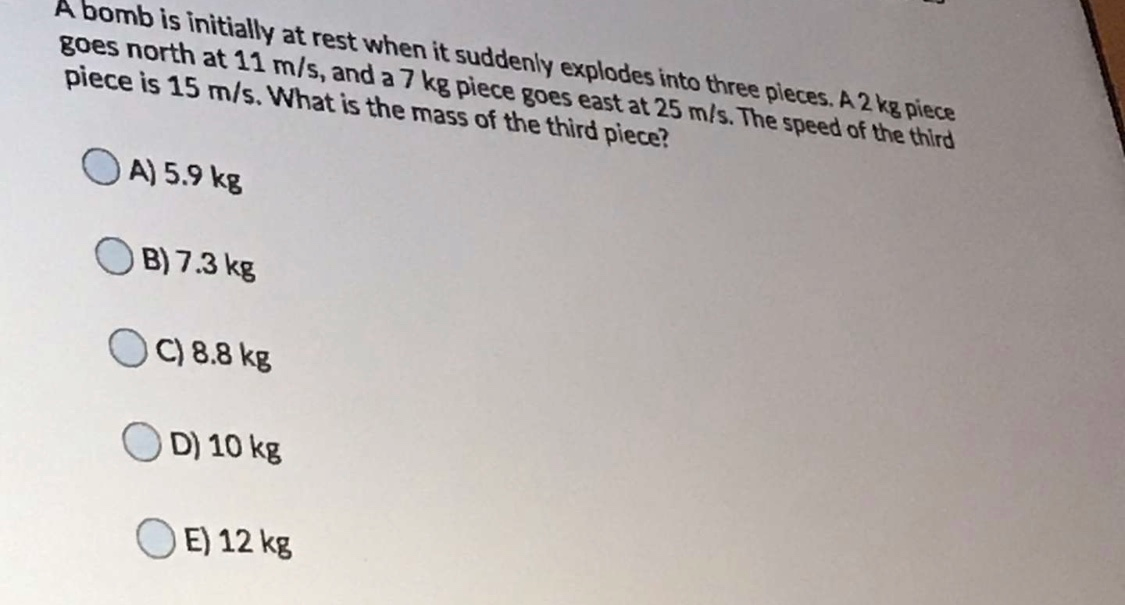 Solved A bomb is initially at rest when it suddenly explodes | Chegg.com