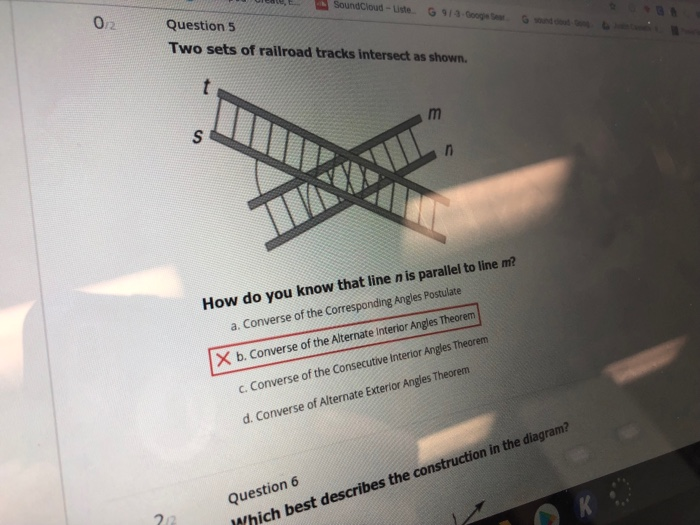 Solved 02 Question5 Two sets of railroad tracks intersect as | Chegg.com