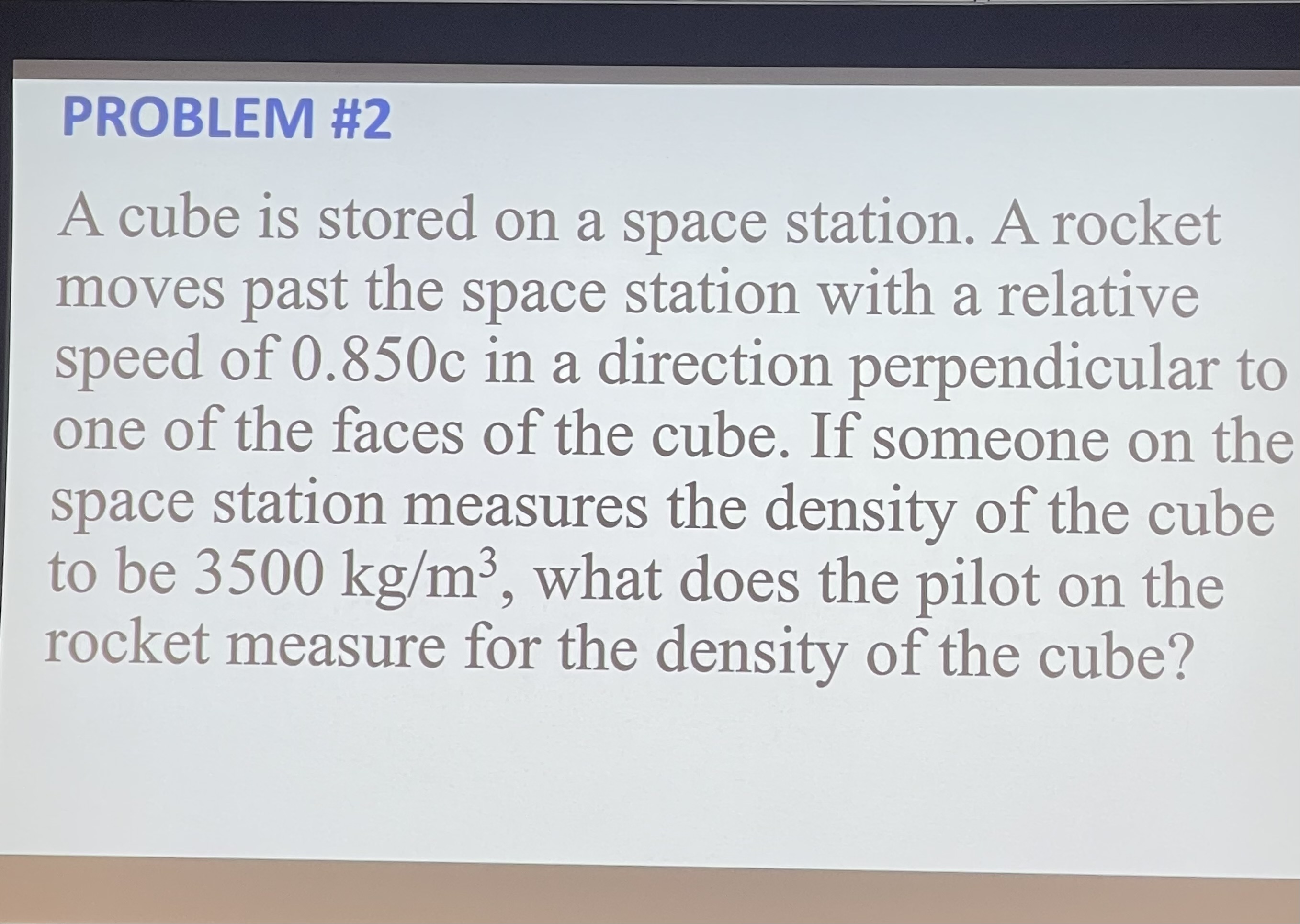 Solved A cube is stored on a space station. A rocket moves | Chegg.com