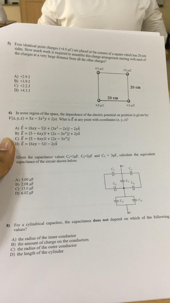 Solved 5) Four identical point charges (+4.0 uC) are placed | Chegg.com