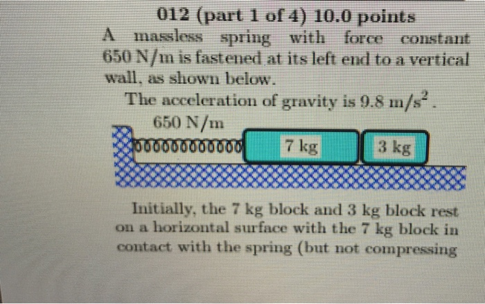 Solved 012 (part 1 of 4) 10.0 points A massless spring with | Chegg.com
