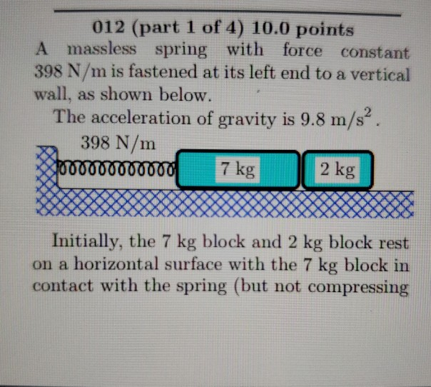 Solved 012 (part 1 of 4) 10.0 points A massless spring with | Chegg.com
