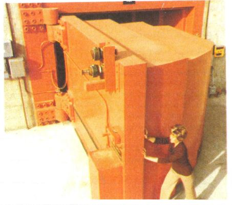 Solved The figure shows a massive door at a neutron test | Chegg.com