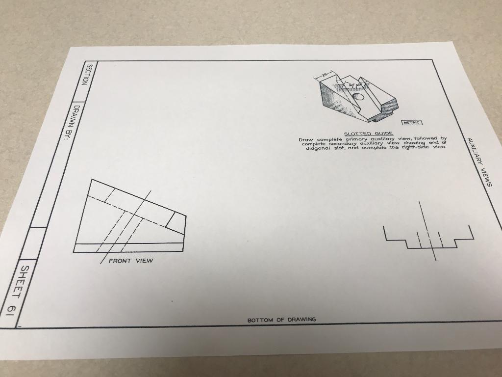 Solved SECTION DRAWN BY METRIC SLOTTED GUIDE Draw complete | Chegg.com