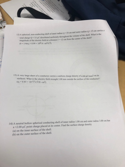 Solved 12) A spherical, non-conducting shell of inner radius | Chegg.com