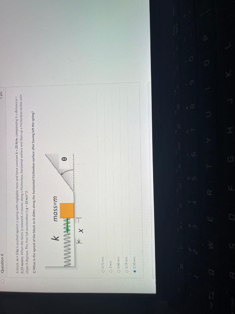 Solved A block, m=5 kg is pushed against a spring with | Chegg.com