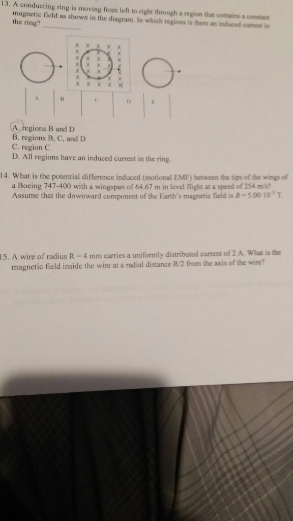 Solved 13. A conducting ring is moving from left to right | Chegg.com
