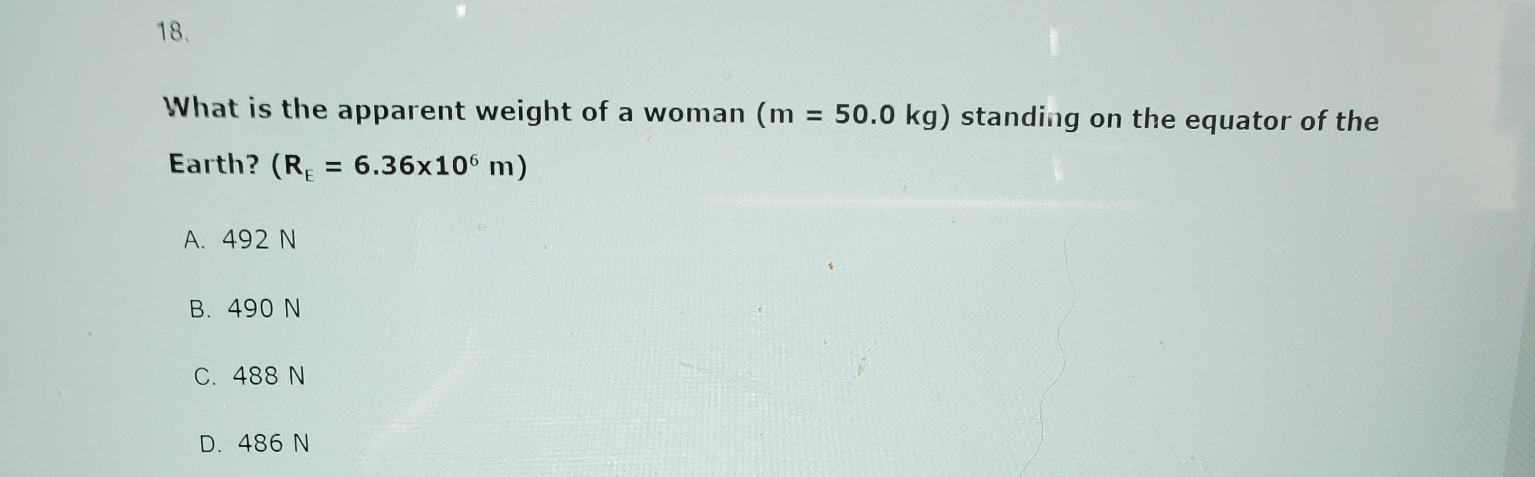 Solved What is the apparent weight of a woman (m=50.0 kg) | Chegg.com