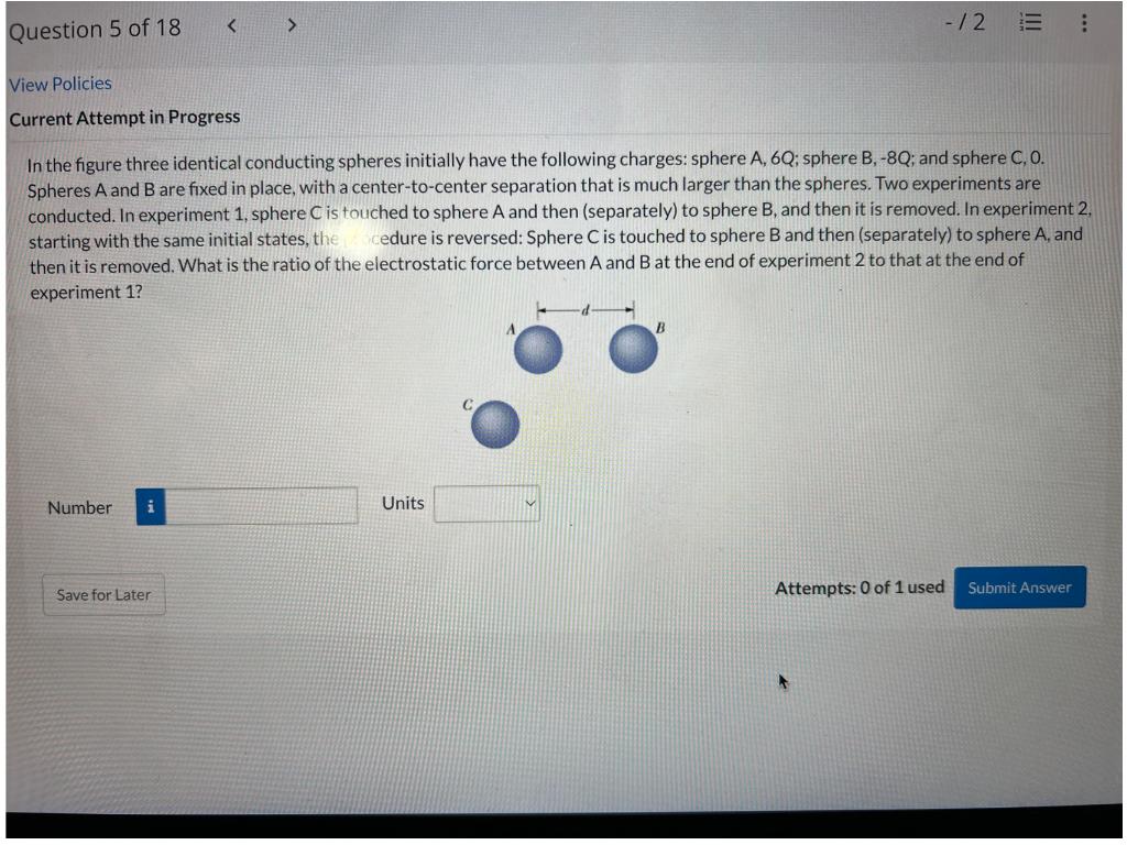 Solved In the figure three identical conducting spheres | Chegg.com