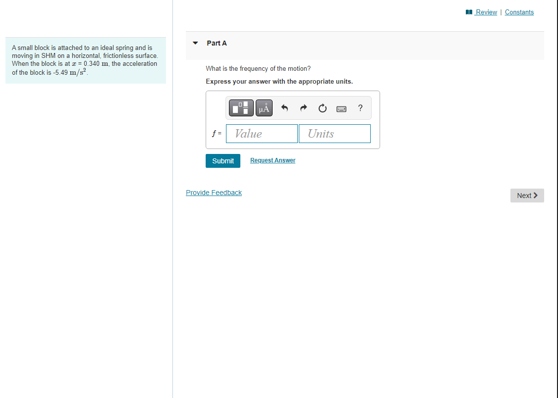 Solved A small block is attached to an ideal spring and is | Chegg.com