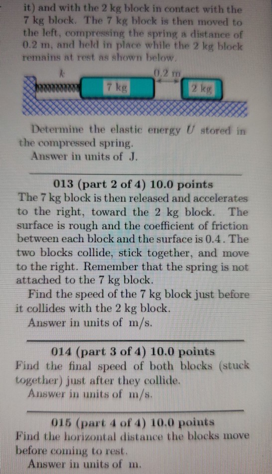 Solved 012 (part 1 of 4) 10.0 points A massless spring with | Chegg.com