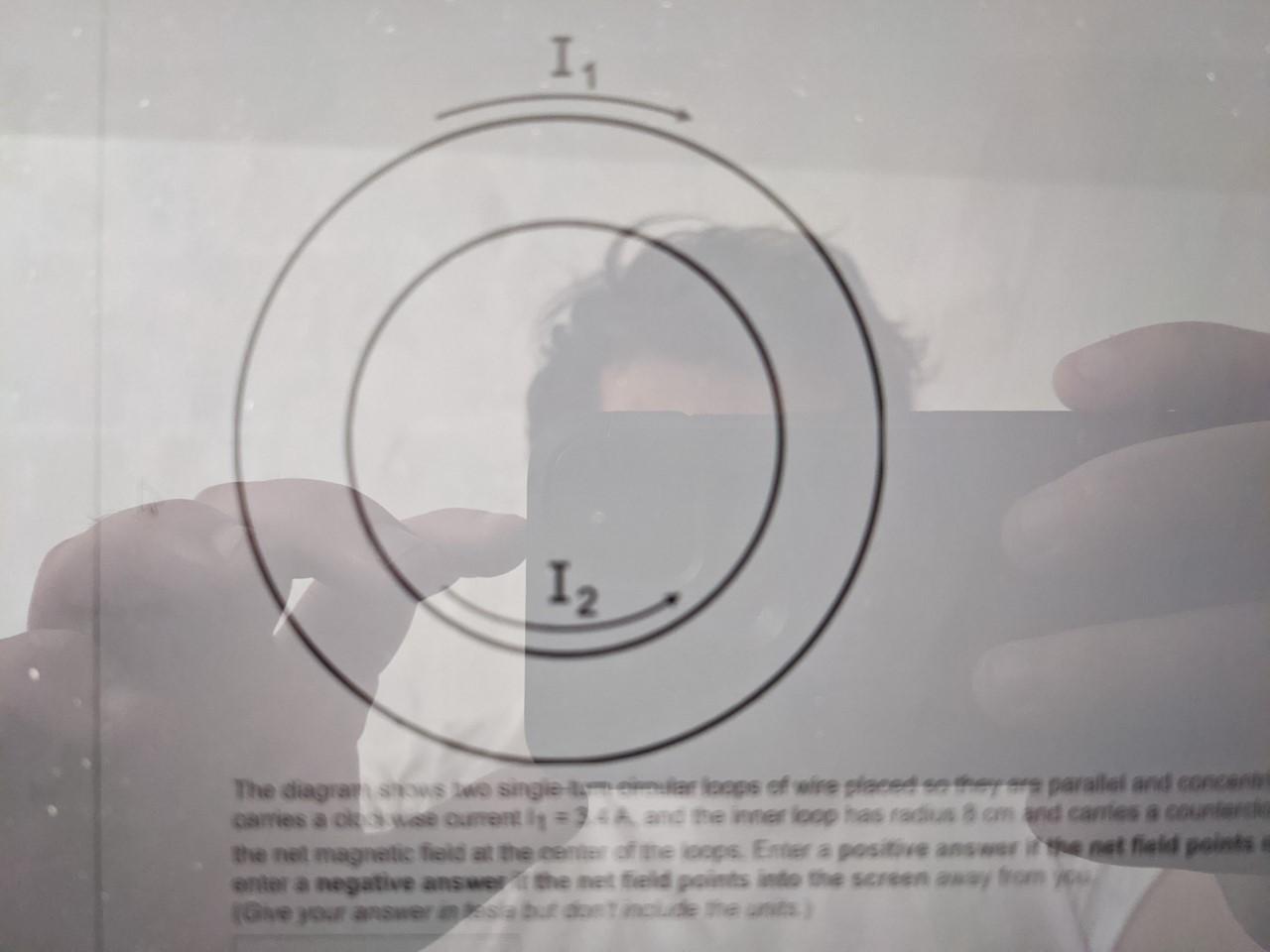 Solved The diagram shows two single-turn circular loops of | Chegg.com
