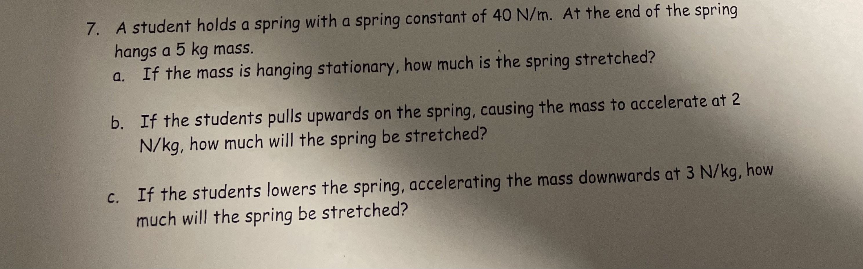 Solved 7. A student holds a spring with a spring constant of | Chegg.com