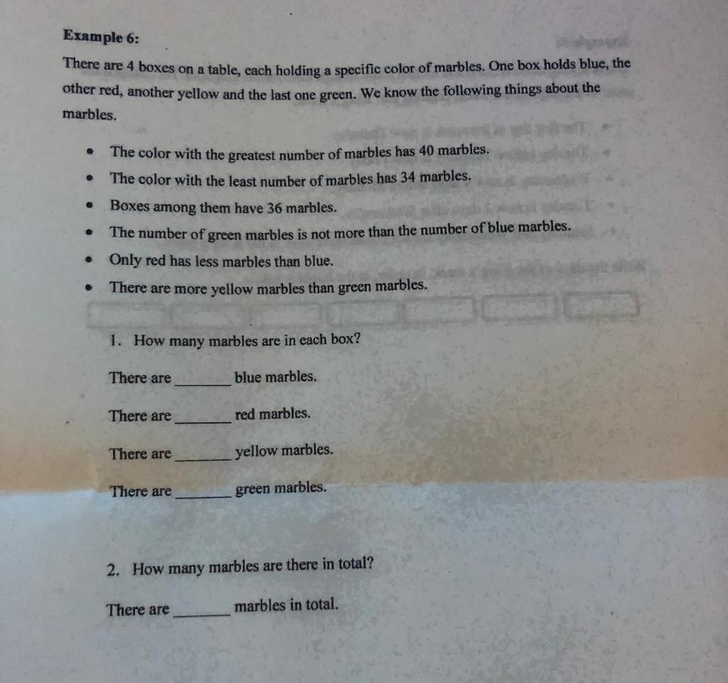 Solved Example 6: There are 4 boxes on a table, each holding | Chegg.com