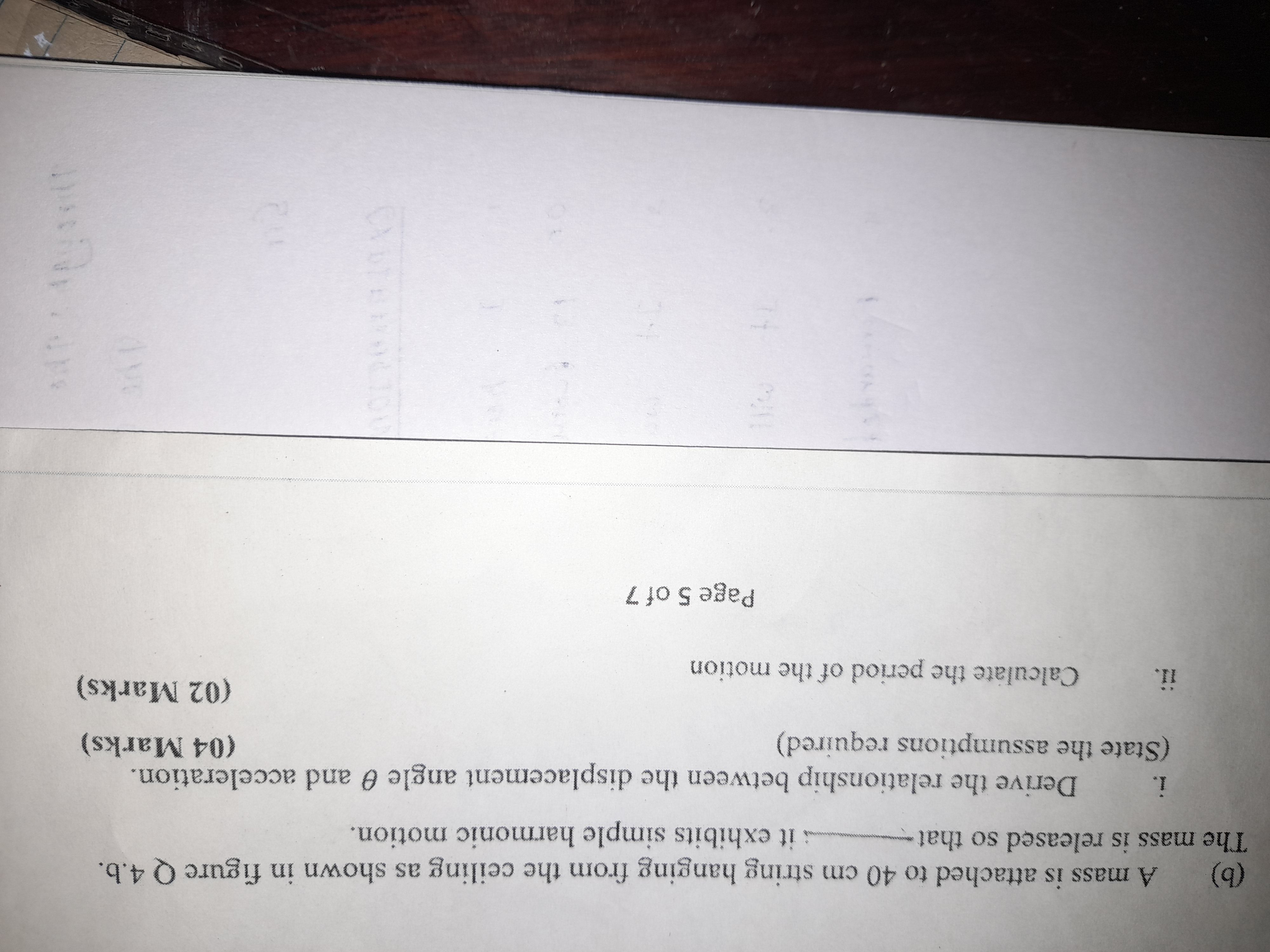 Solved (b) ﻿A mass is attached to 40 ﻿cm string hanging from | Chegg.com