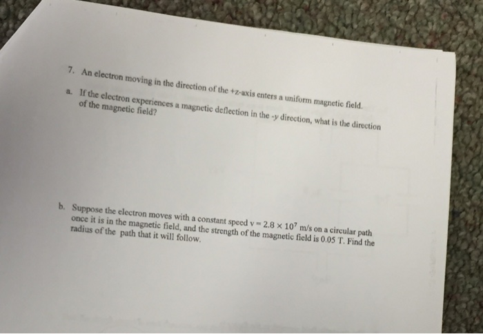 Solved 7. An electron moving in the direction of the +z-axis | Chegg.com