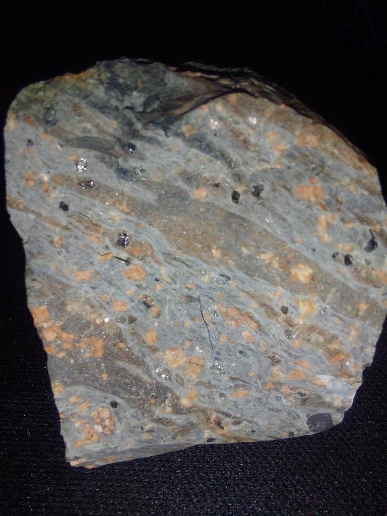 Solved Examine your specimen of Ignimbrite (221). Describe | Chegg.com