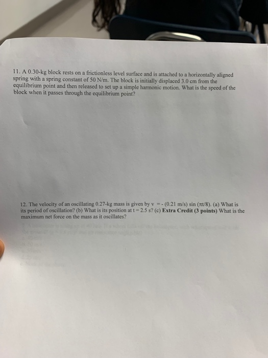 Solved 11. A 0.30-kg block rests on a frictionless level | Chegg.com