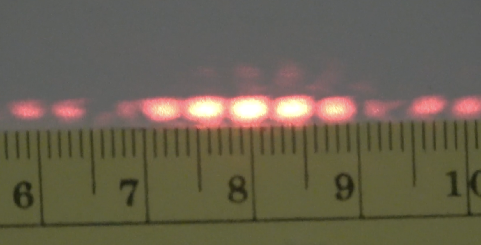 Solved Using a ruler (in cm) placed next to the | Chegg.com