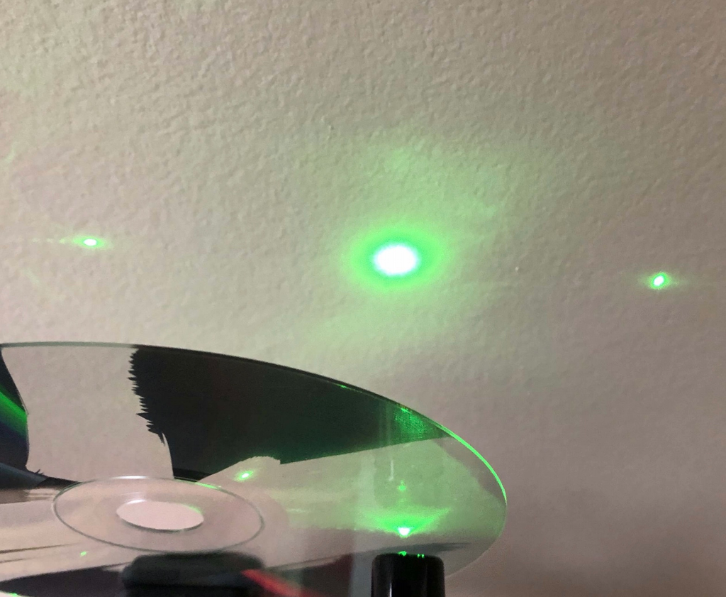 Solved Data on a compact disc (CD) is represented as tiny | Chegg.com