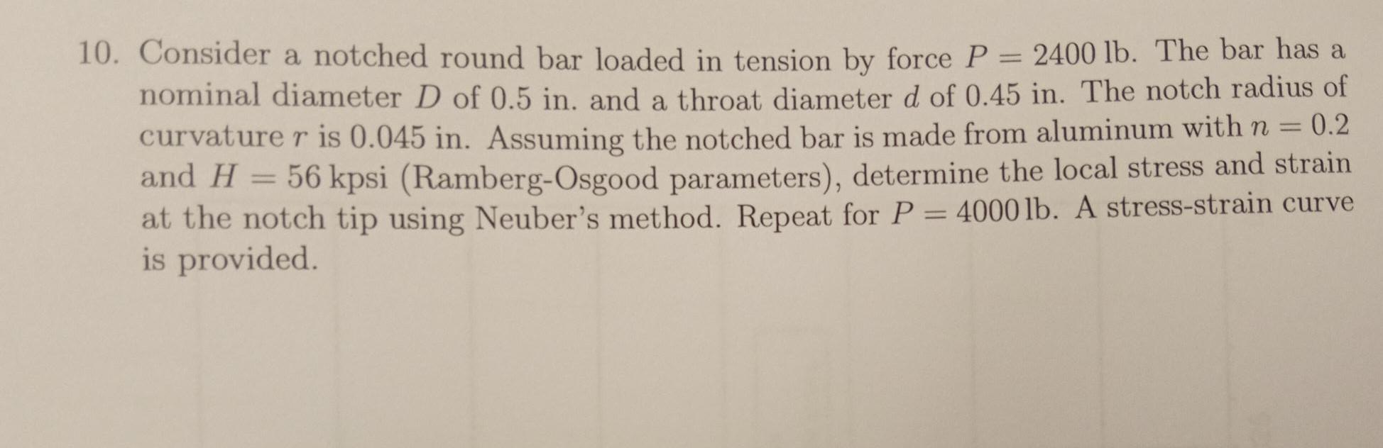 10. Consider a notched round bar loaded in tension by | Chegg.com