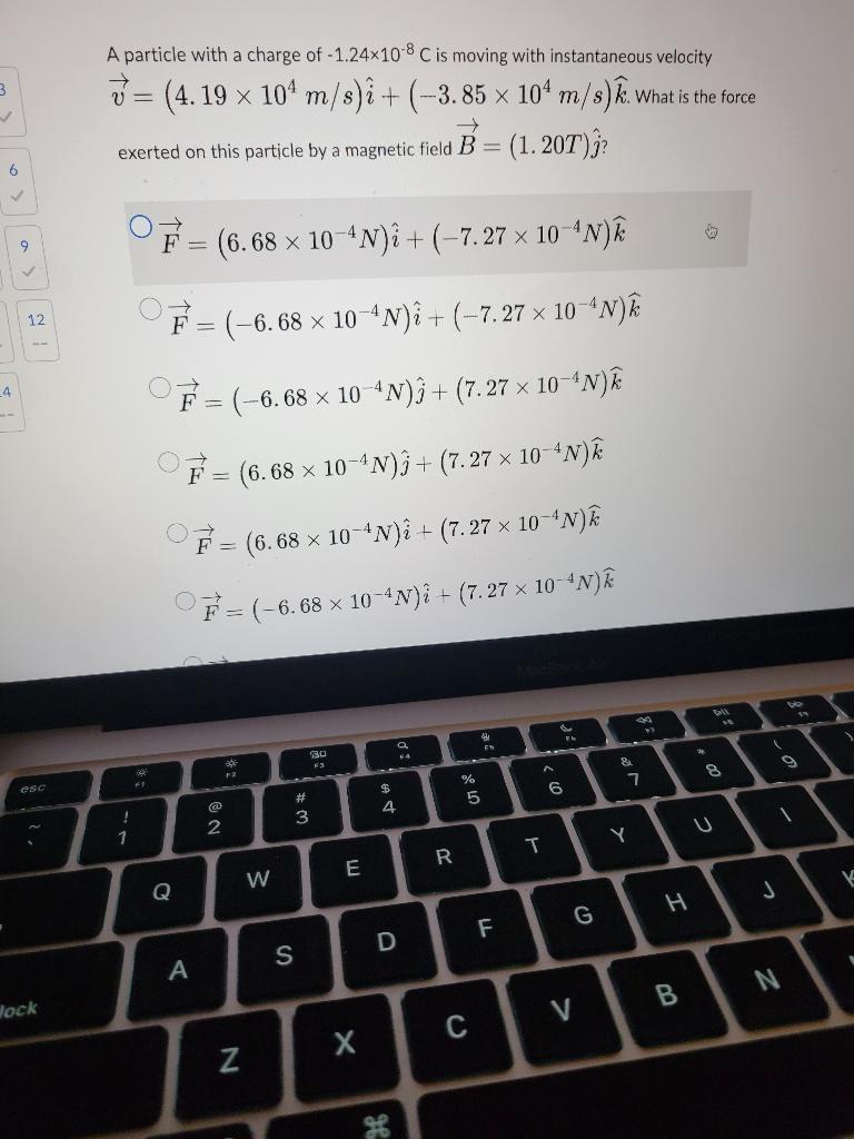 Solved A particle with a charge of −1.24×10−8C is moving | Chegg.com