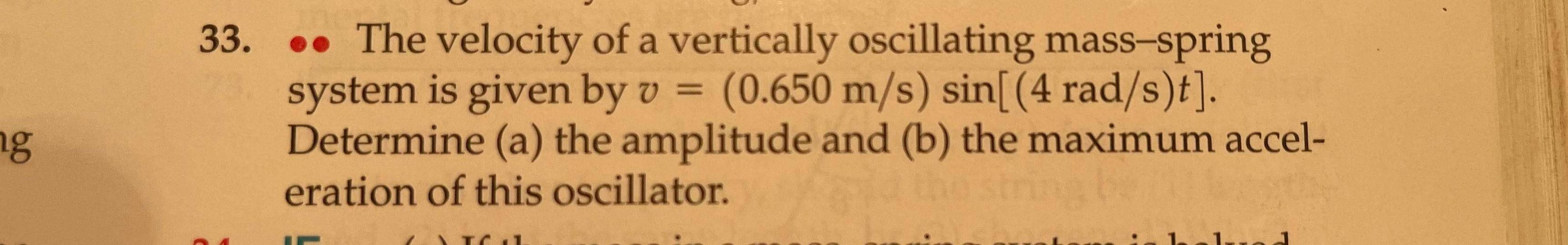 Solved ng 33. The velocity of a vertically oscillating | Chegg.com