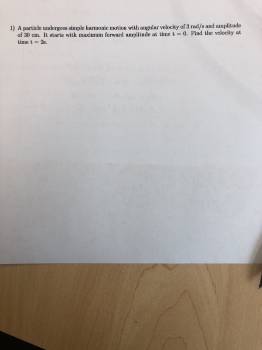 Solved 1) A particle undergoes simple harmonic motion with | Chegg.com