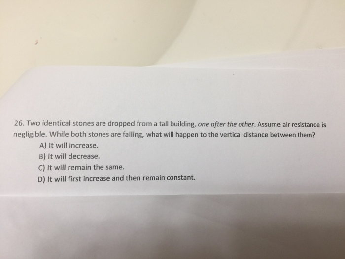 Solved 26. Two identical stones are dropped from a tall | Chegg.com
