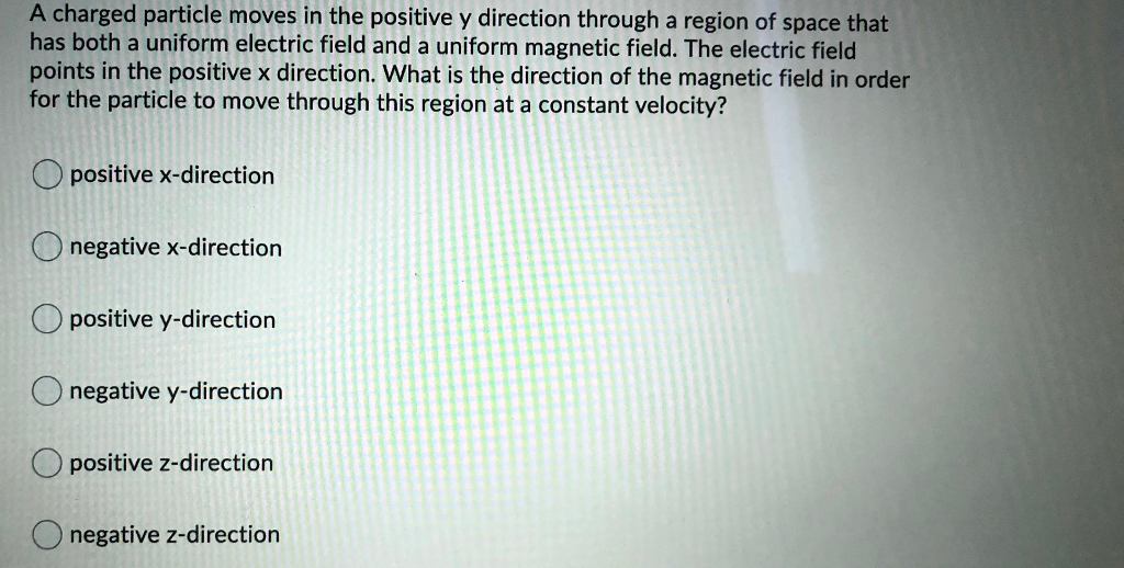 Solved A charged particle moves in the positive y direction | Chegg.com