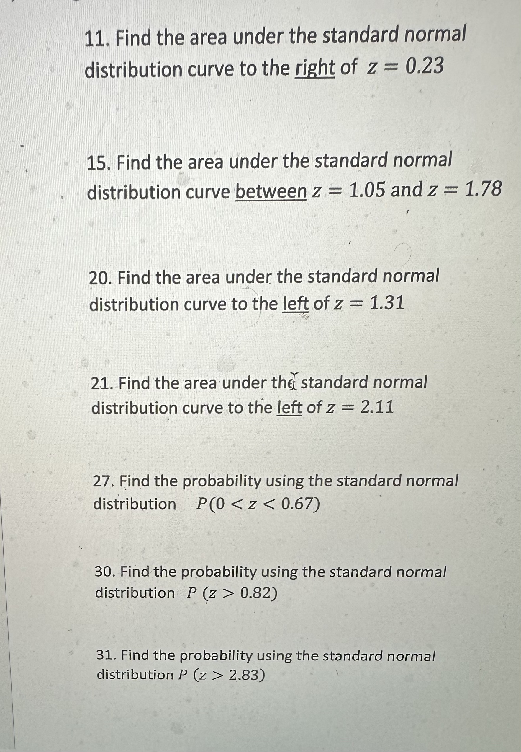 Solved 11. Find the area under the standard normal | Chegg.com