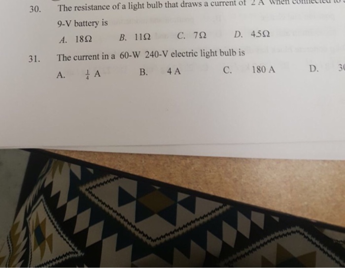 Solved The resistance of a light bulb that draws a current | Chegg.com