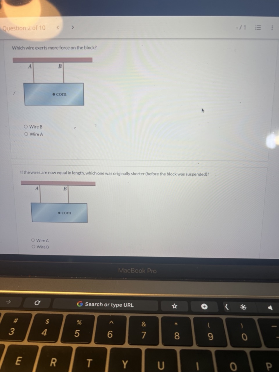 Solved The figure shows a horizontal block that is suspended | Chegg.com