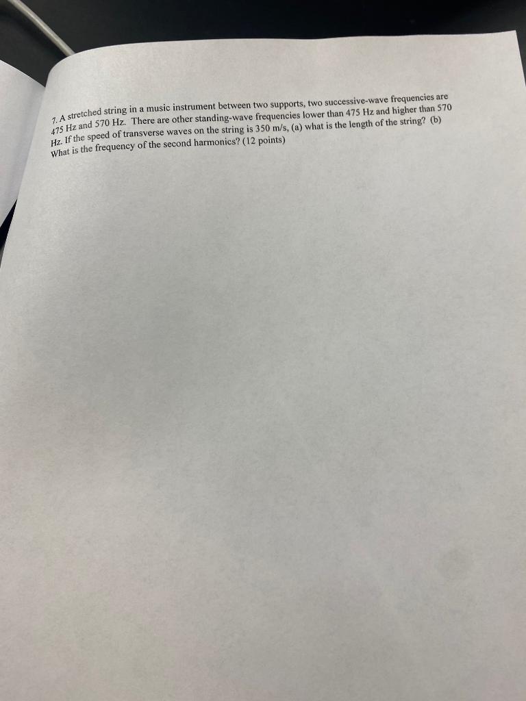 Solved 7. A stretched string in a music instrument between | Chegg.com