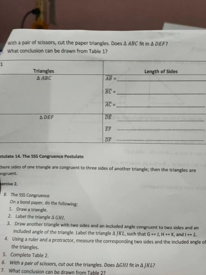 Solved with a pair of scissors, cut the paper triangles. | Chegg.com