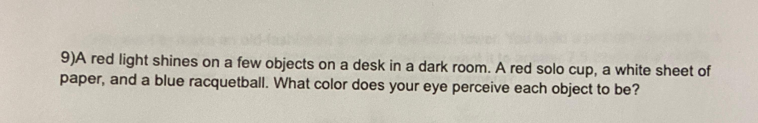 Solved 9)A red light shines on a few objects on a desk in a | Chegg.com