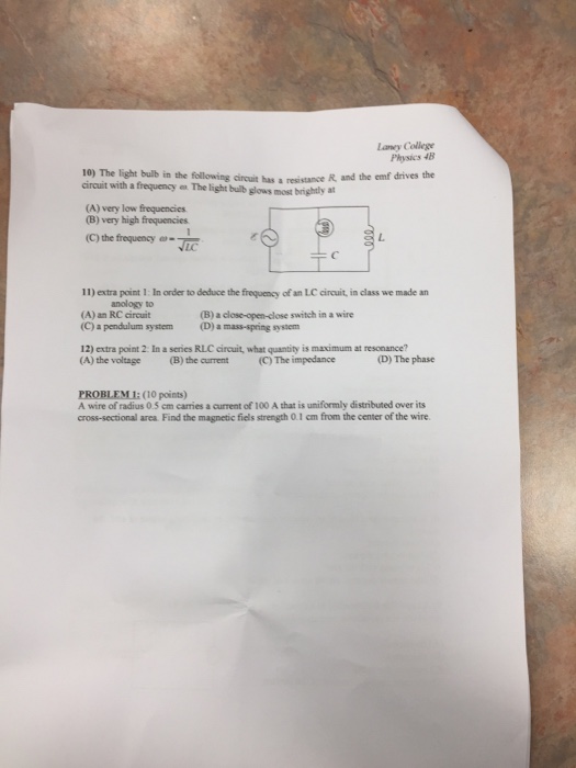 Solved Laney College Physics 4B 10) The light bulb in the | Chegg.com