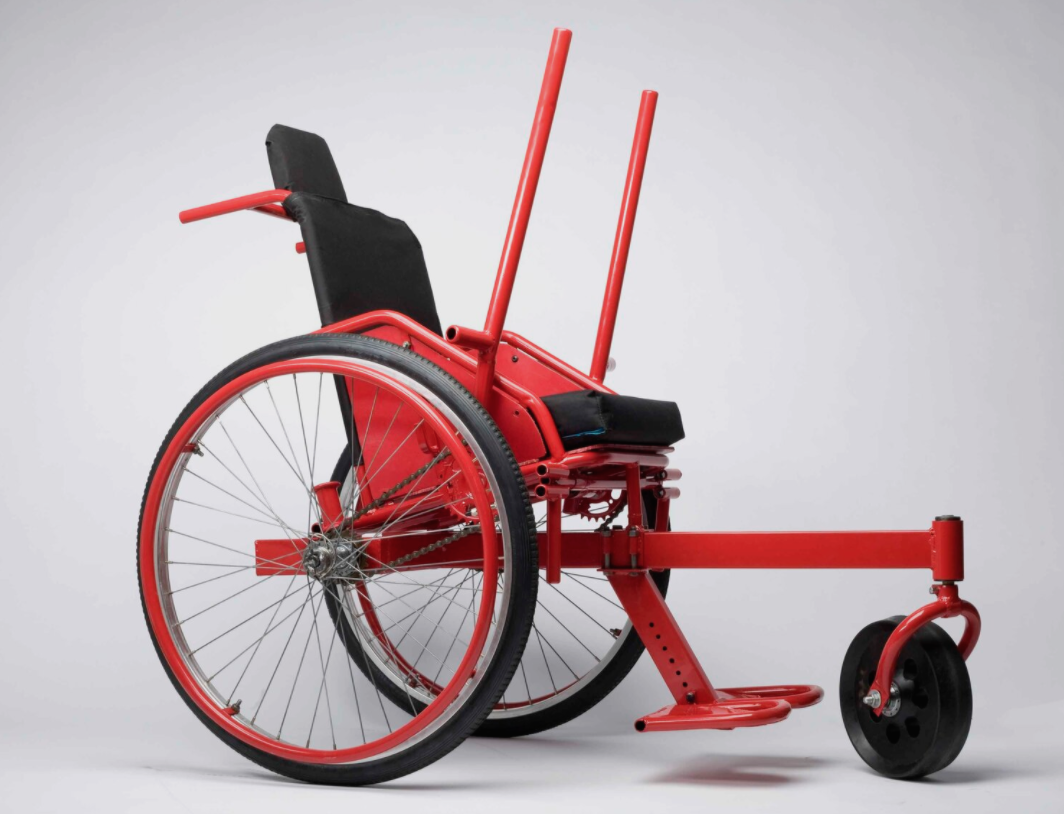 A wheelchair with a lever-driven chain-sprocket | Chegg.com