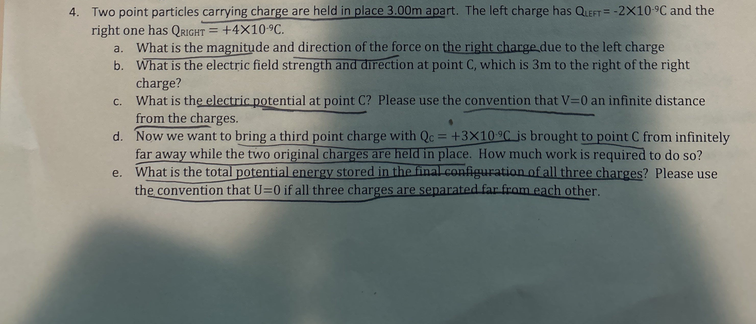 Solved Two point particles carrying charge are held in place | Chegg.com