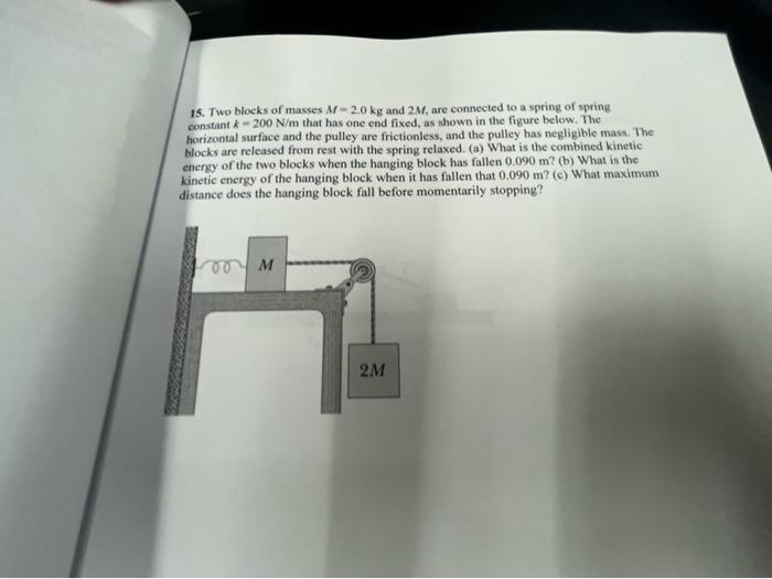 Solved 15. Two blocks of masses M=2.0 kg and 2M, are | Chegg.com