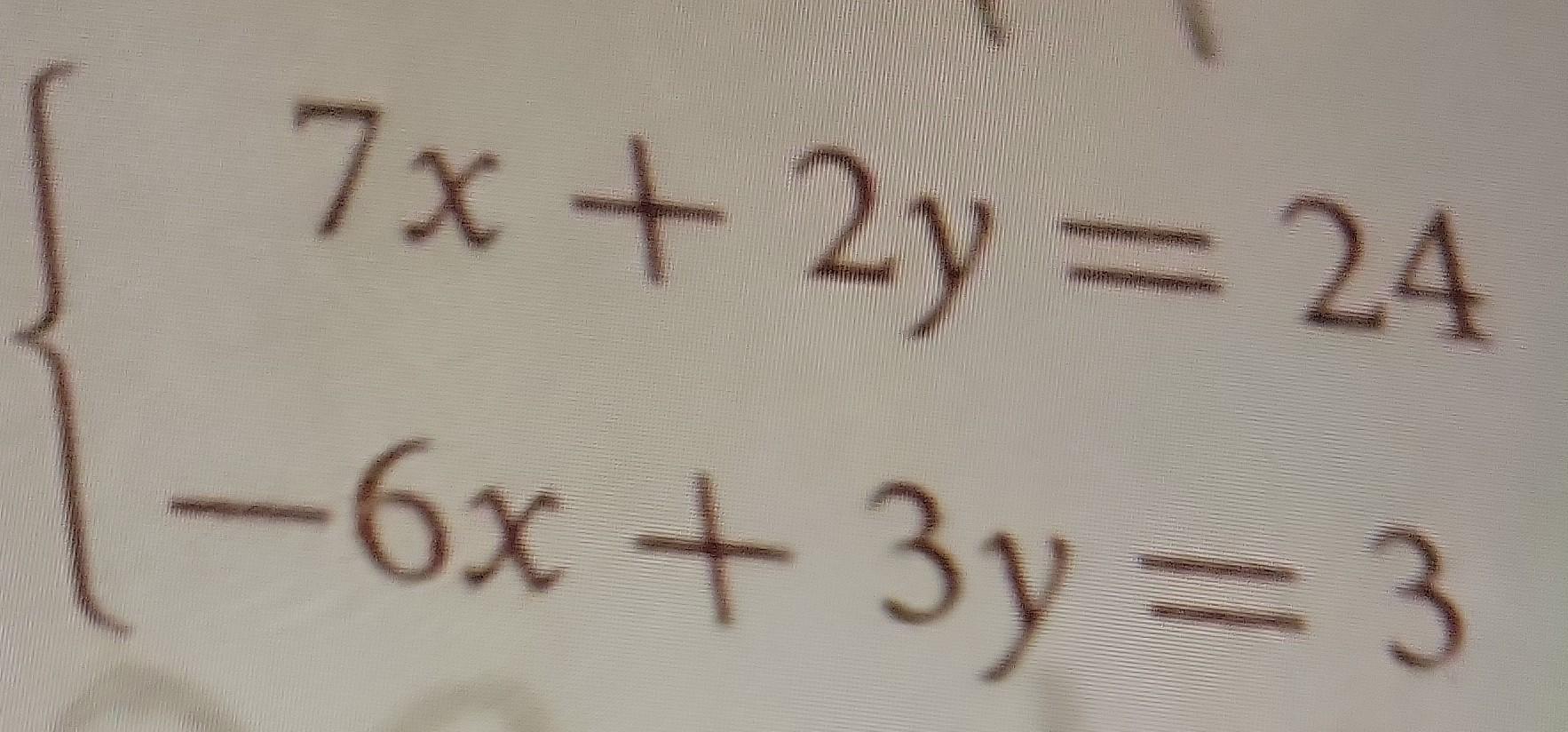 Solved {7x+2y=24−6x+3y=3 | Chegg.com