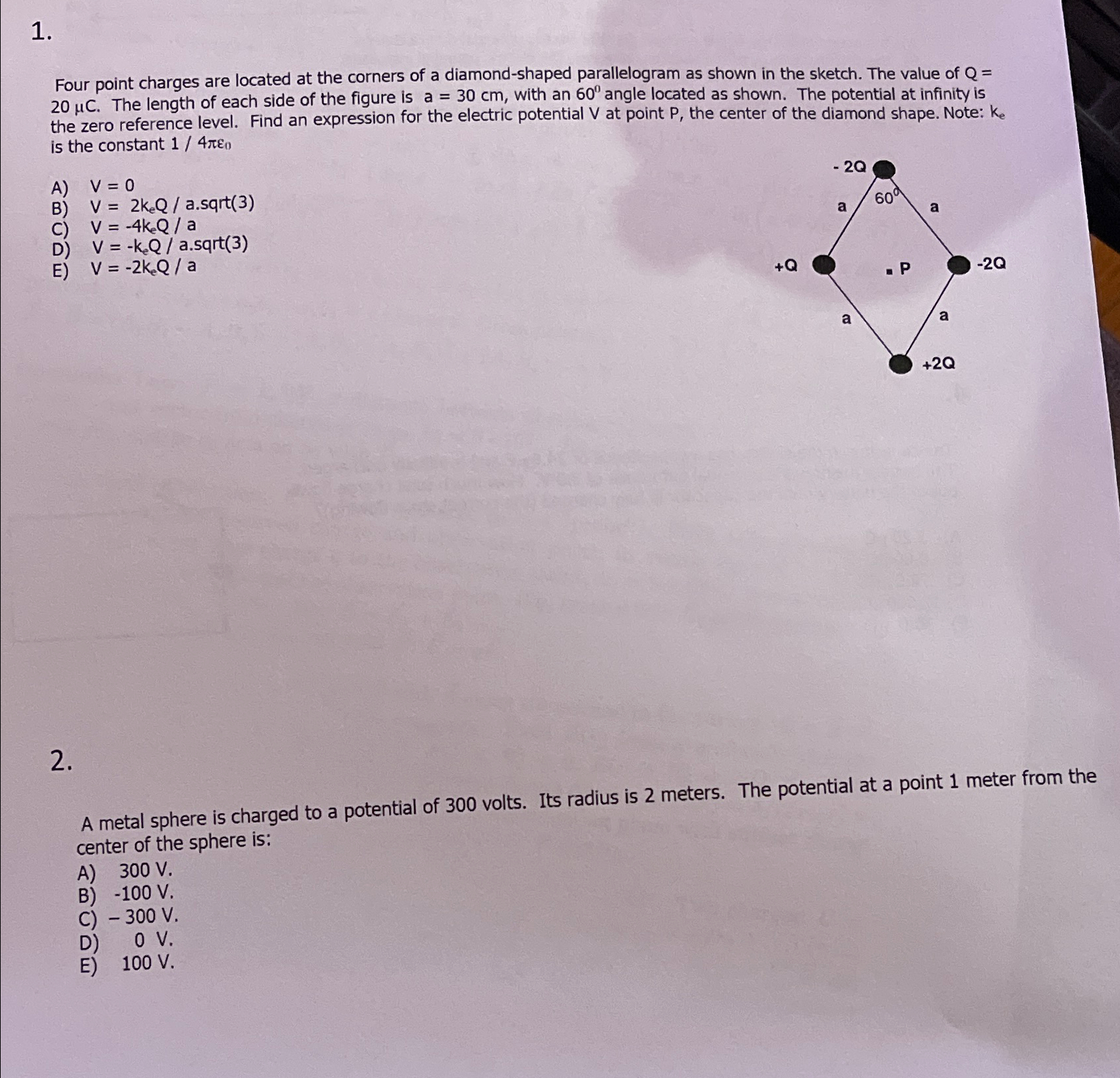 Solved Four point charges are located at the corners of a | Chegg.com