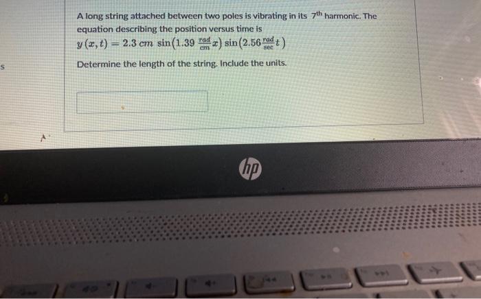 Solved S A long string attached between two poles is | Chegg.com