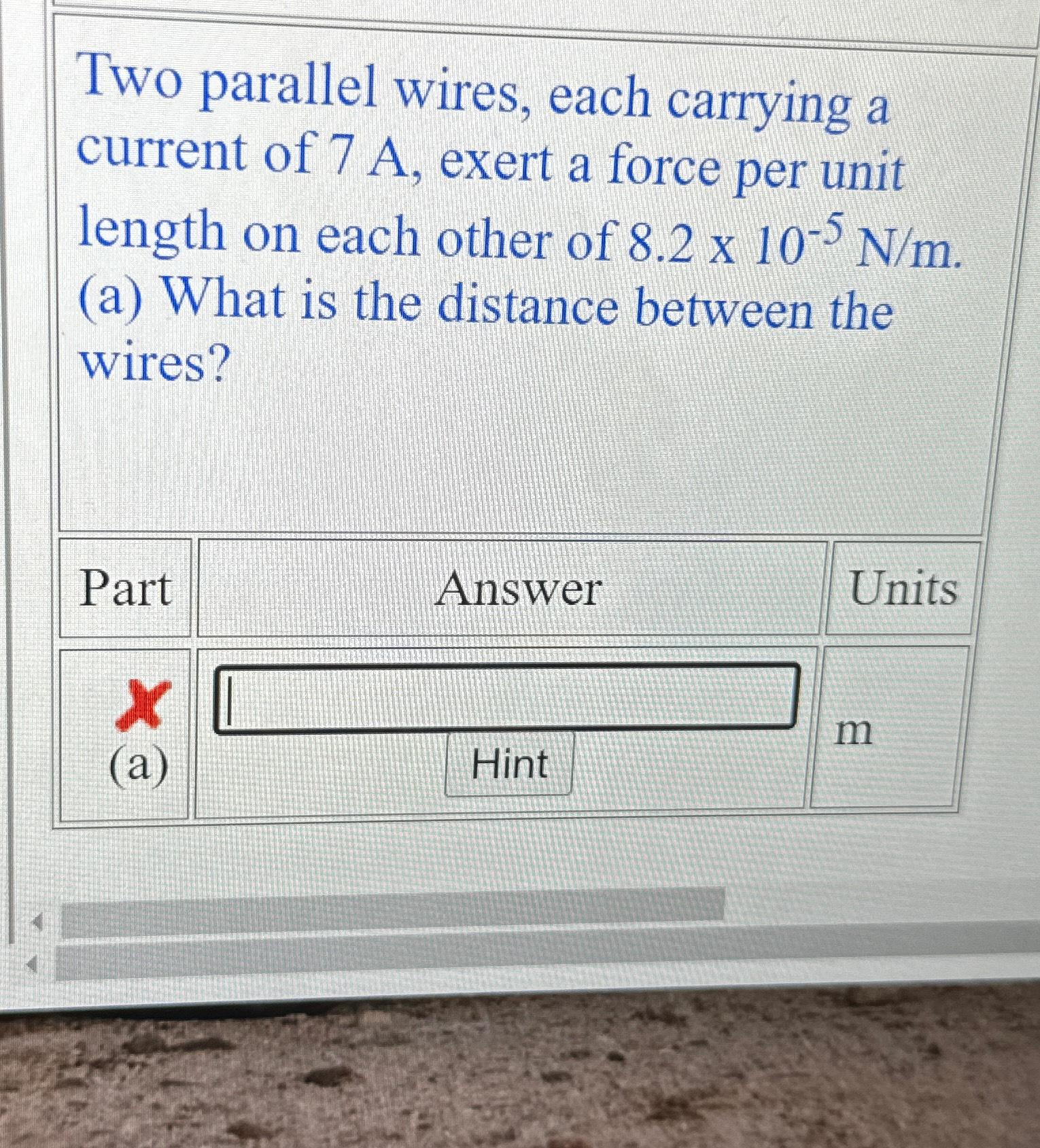 Solved Two parallel wires, each carrying a current of 7A, | Chegg.com