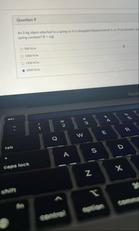 Solved Question 9An 5-kg ﻿object attached to a spring so it | Chegg.com