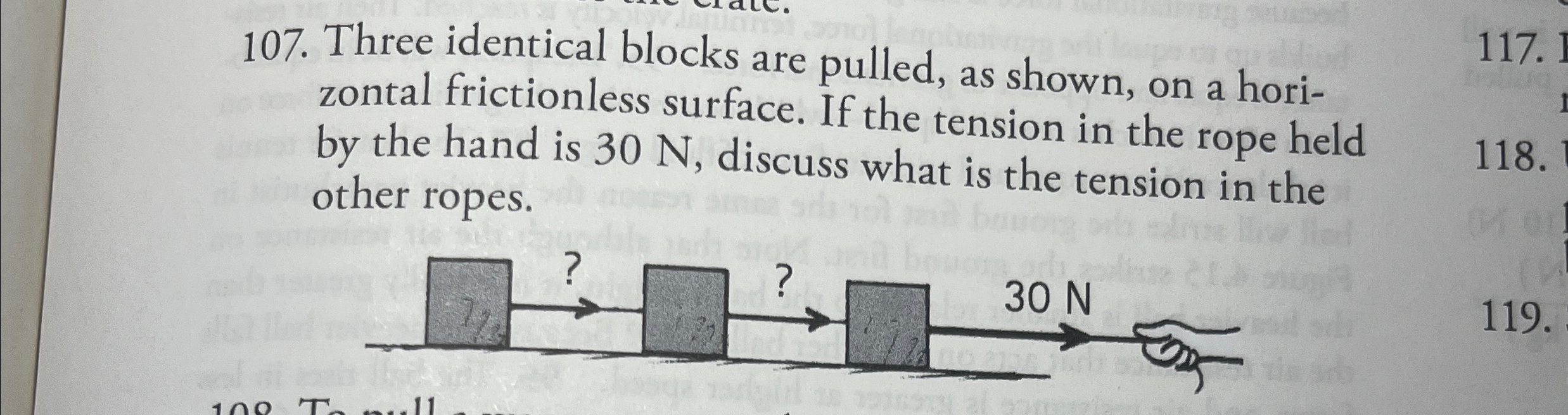 Solved Three identical blocks are pulled, as shown, on a | Chegg.com