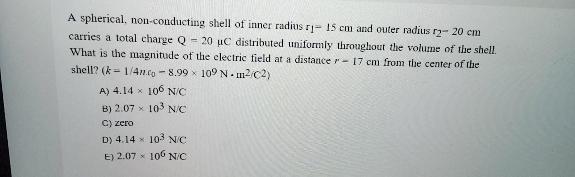 Solved A spherical, non-conducting shell of inner radius | Chegg.com