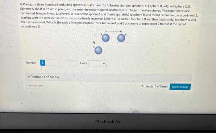 Solved In the figure three identical conducting spheres | Chegg.com
