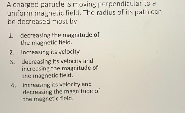 Solved A charged particle is moving perpendicular to a | Chegg.com