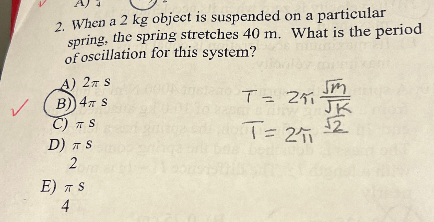 Solved When a 2kg ﻿object is suspended on a particular | Chegg.com
